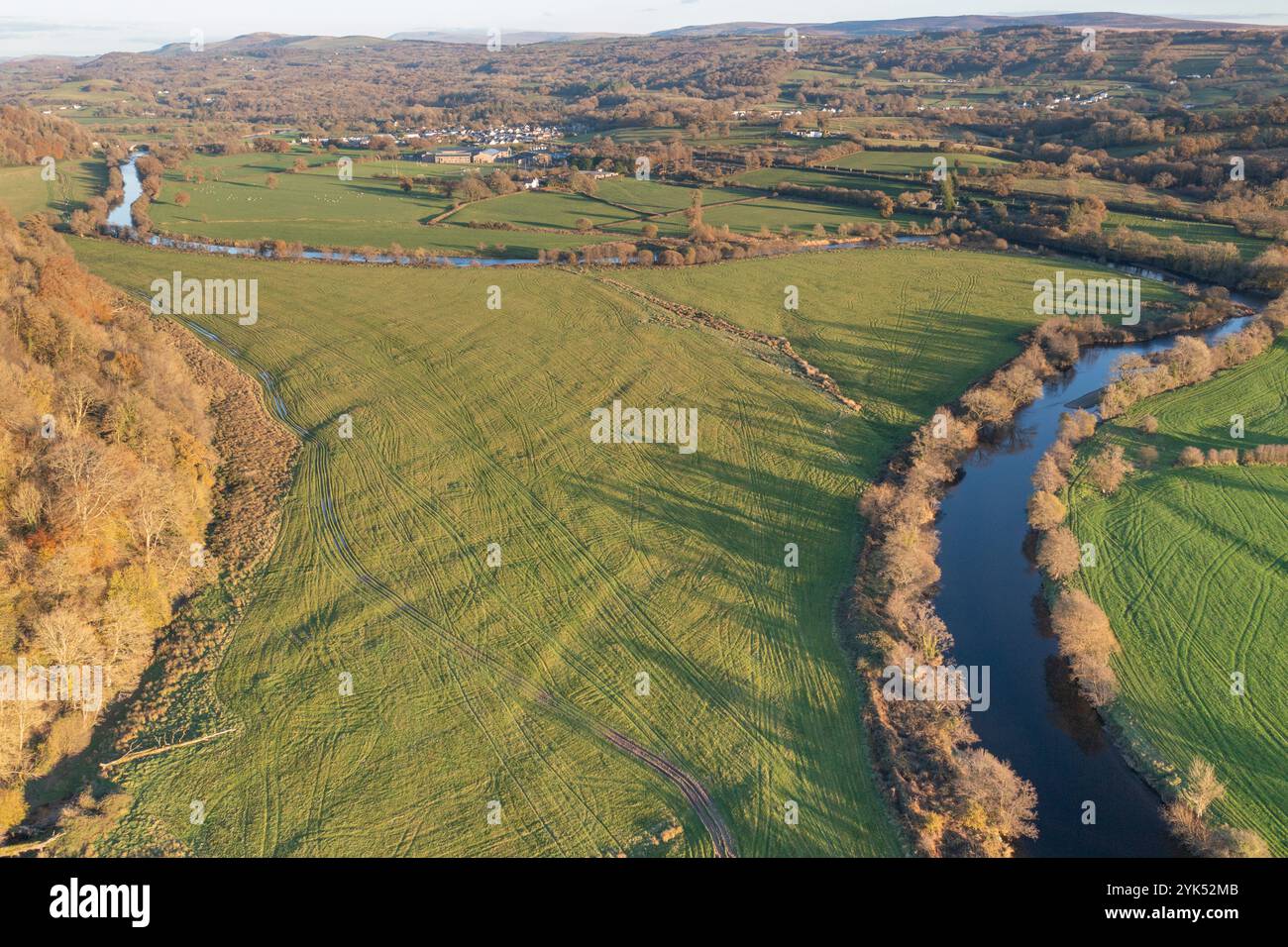 Aerial view of River Towy and floodplain silage fields with vehicle ...