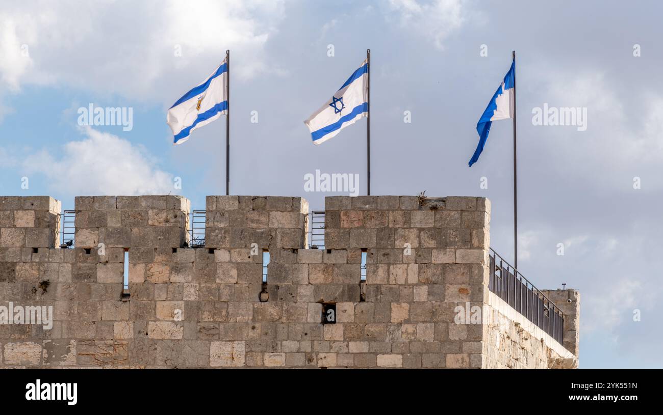 Three flags flying over a stone wall at Jaffa Gate in Jerusalem Stock ...