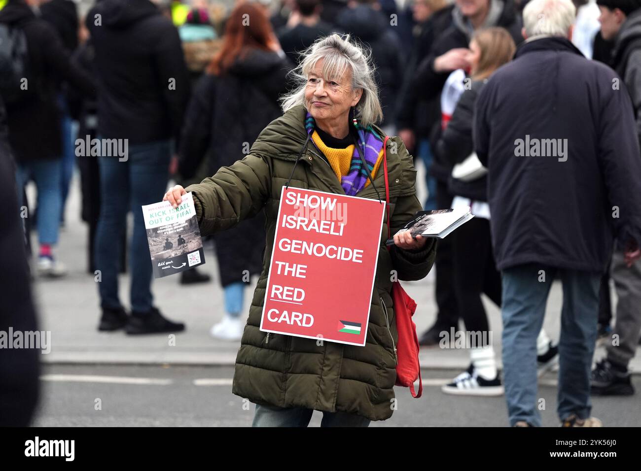 A member of the public hands out leaflets regarding Israel's inclusion ...