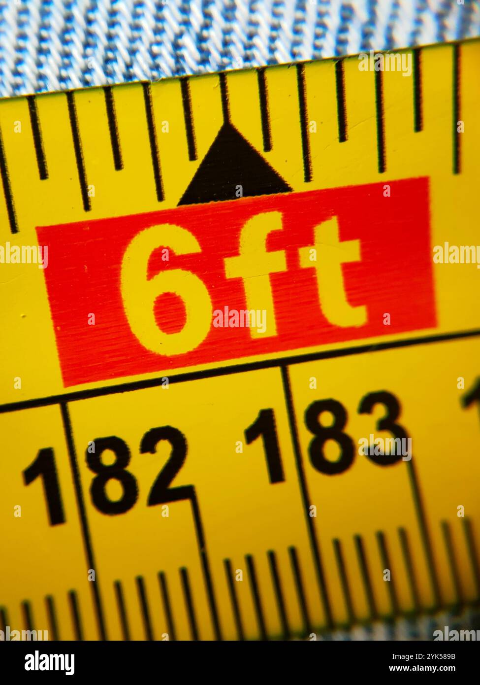 Yellow tape measure, combining metric and imperial units. Useful to ...