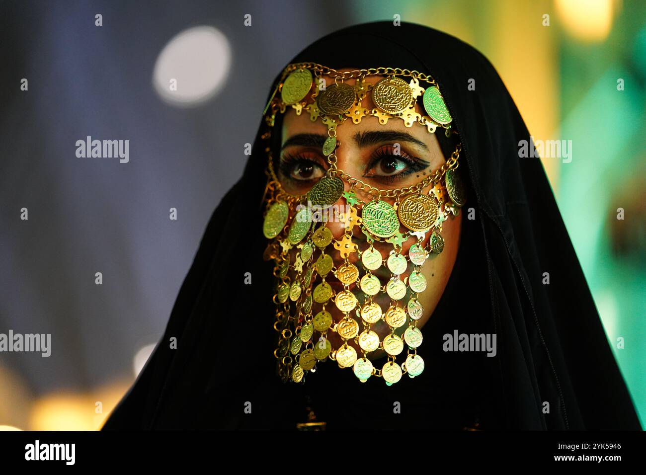 A young woman wearing a burqa seen during the Baghdad Day Festival on ...