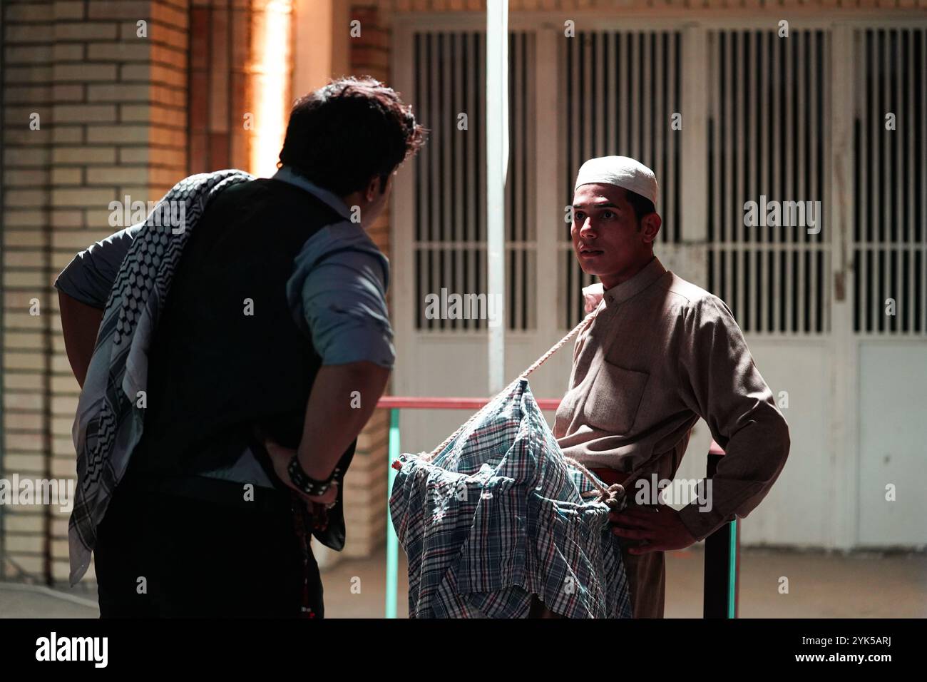 November 13, 2024, Baghdad, Iraq: Two young men wearing folkloric ...