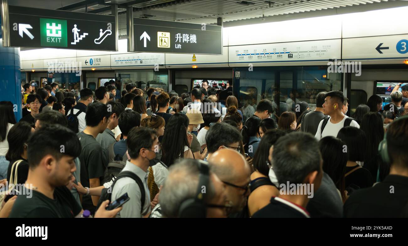Hong Kong 2024 May 2: crowded of people inside the station of MTR. MTR ...