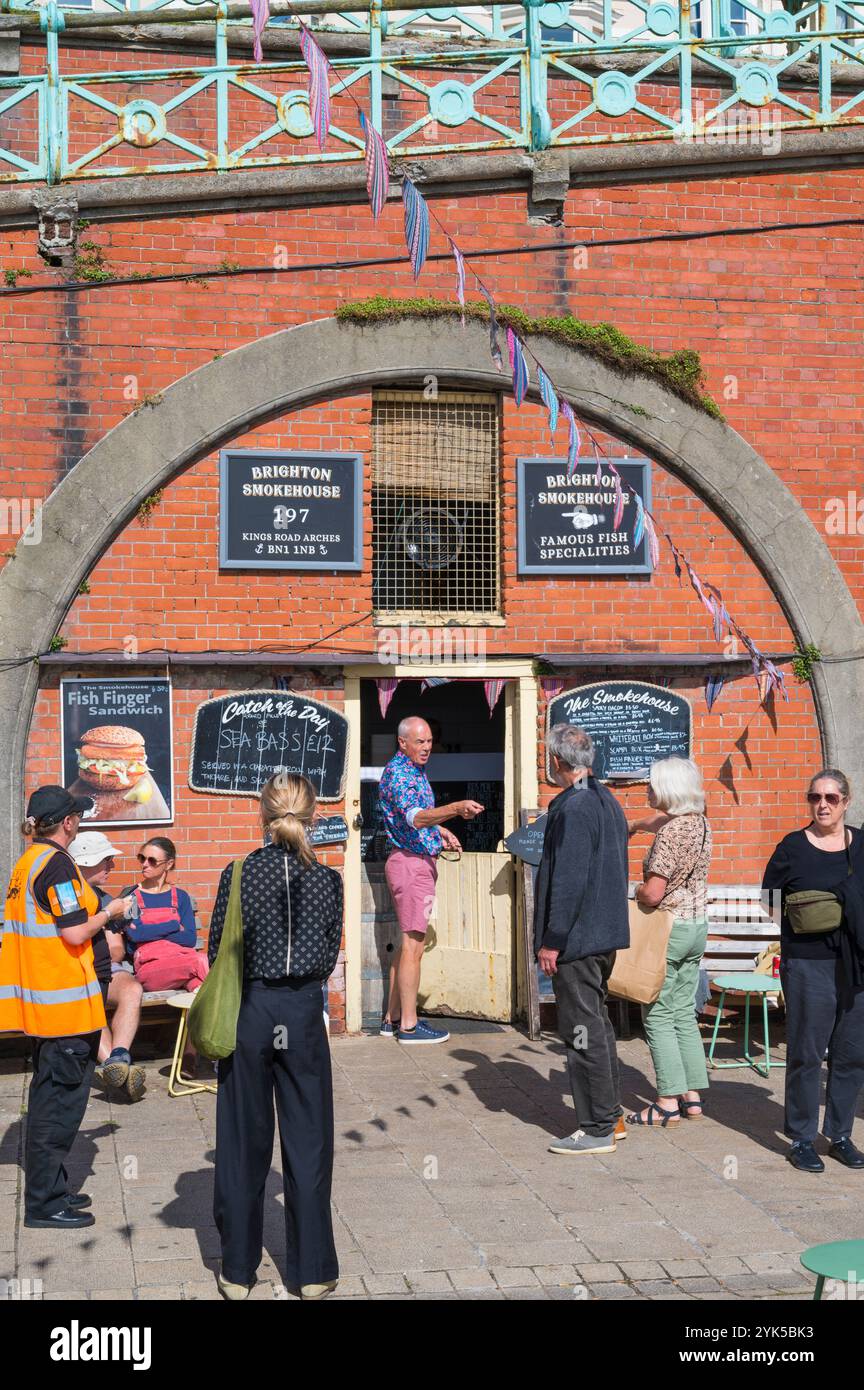 People gathered outside the Brighton Smokehouse fish and seafood ...