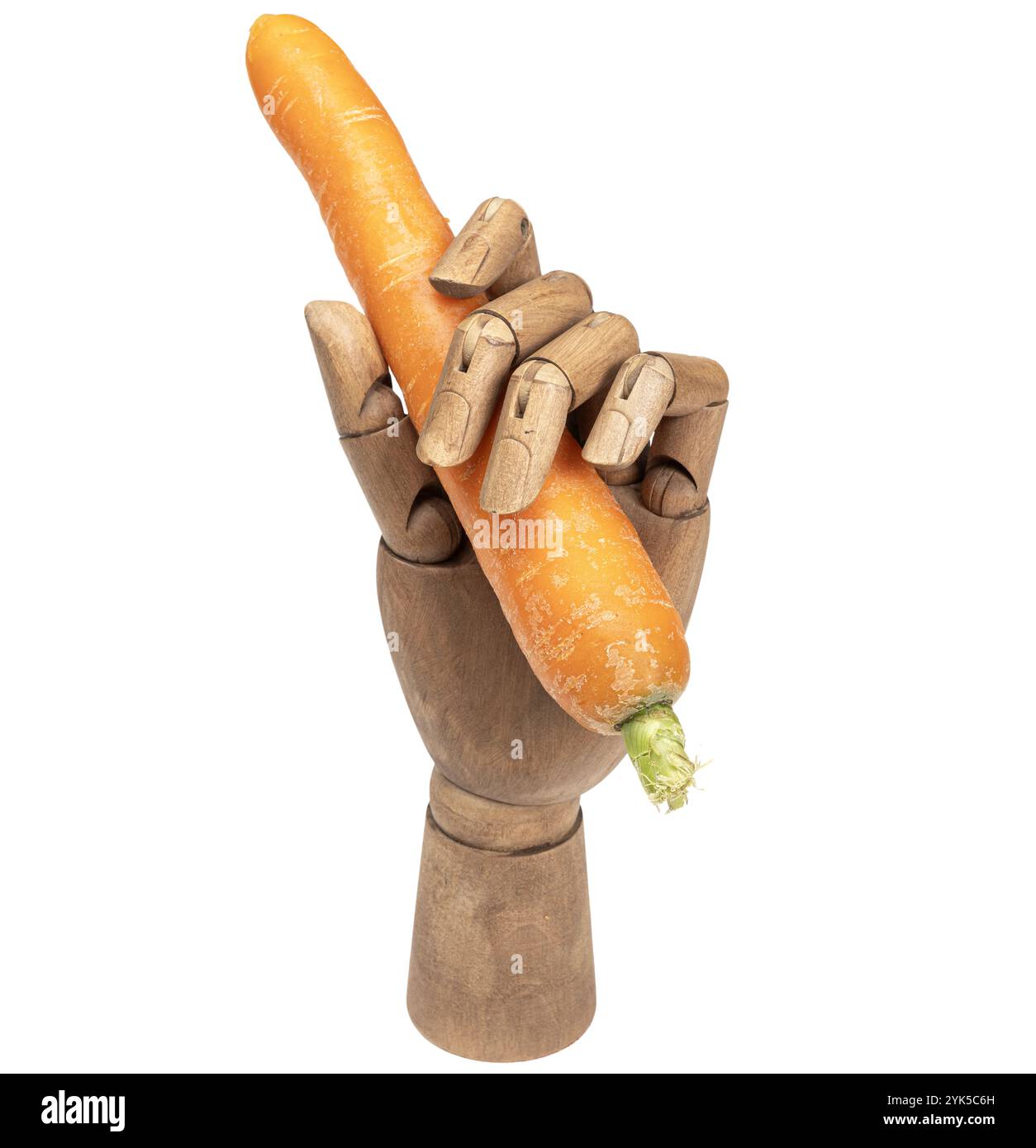 carrot in a wooden hand on a white background Stock Photo - Alamy