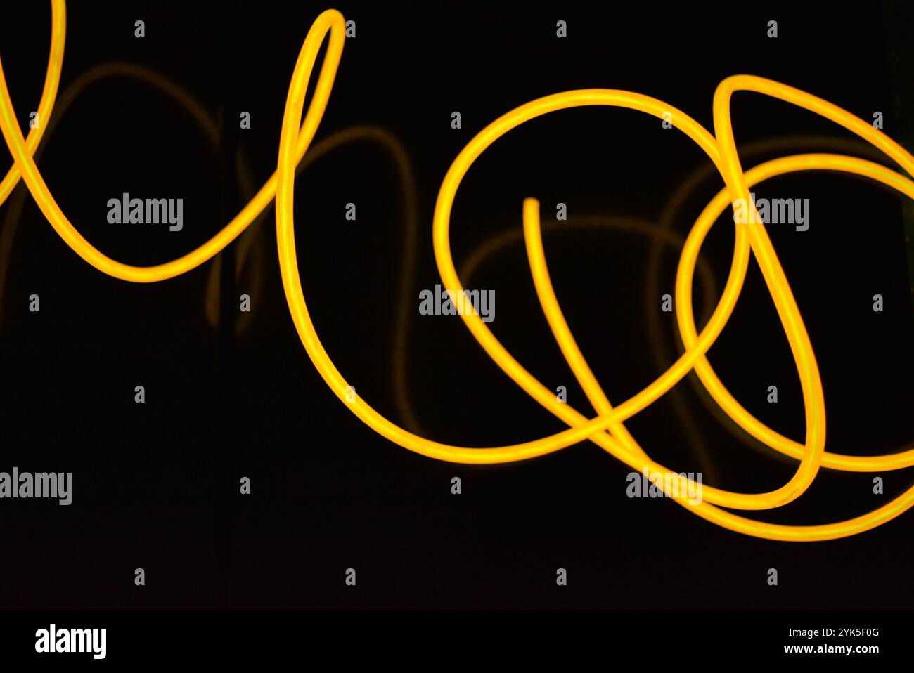 Beautiful thick yellow, orange wires are chaotically located and ...