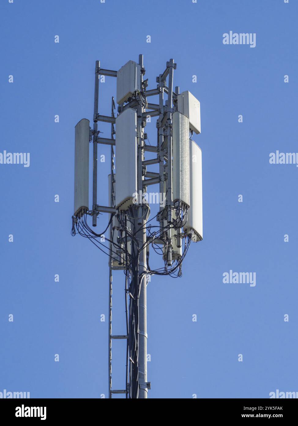 Multiple antennas and electronic equipment are installed on a telecommunication tower, enabling ...
