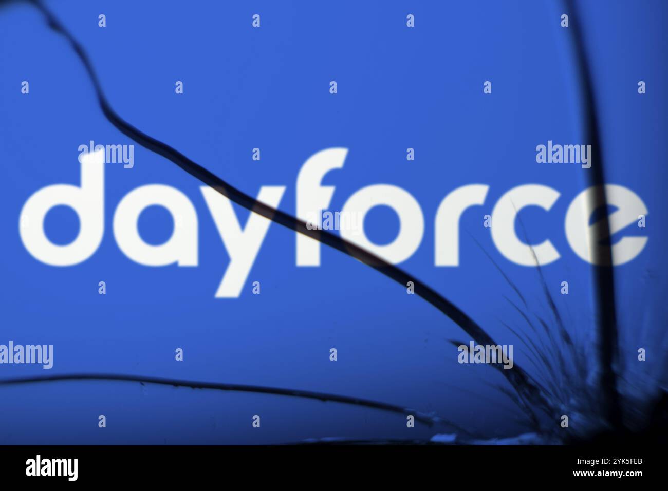 Dayforce logo is visible on the broekn glass Stock Photo - Alamy