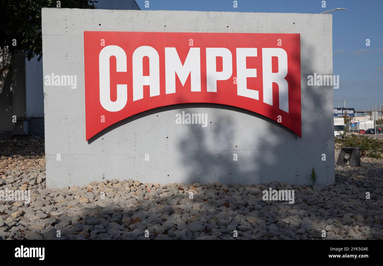 17 November 2024, Spain, Inca: The logo of the shoe brand Camper stands in front of the ...