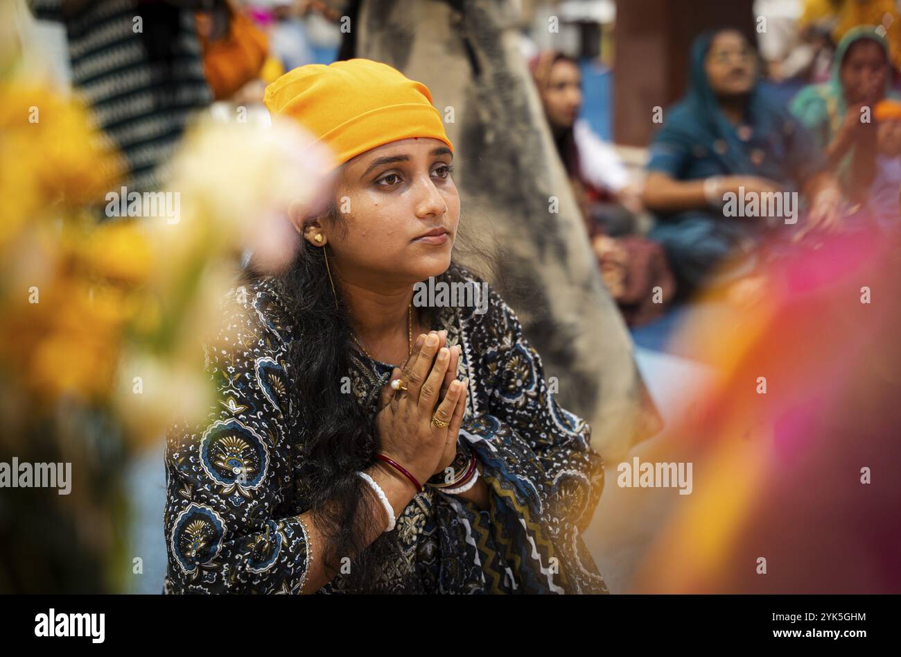 Sikh devotees offer prayers at a Gurudwara on the occasion of Guru ...