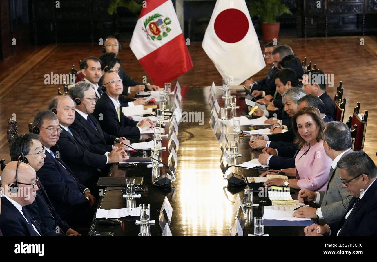 Japanese Prime Minister Shigeru Ishiba (L) and Peruvian President Dina ...