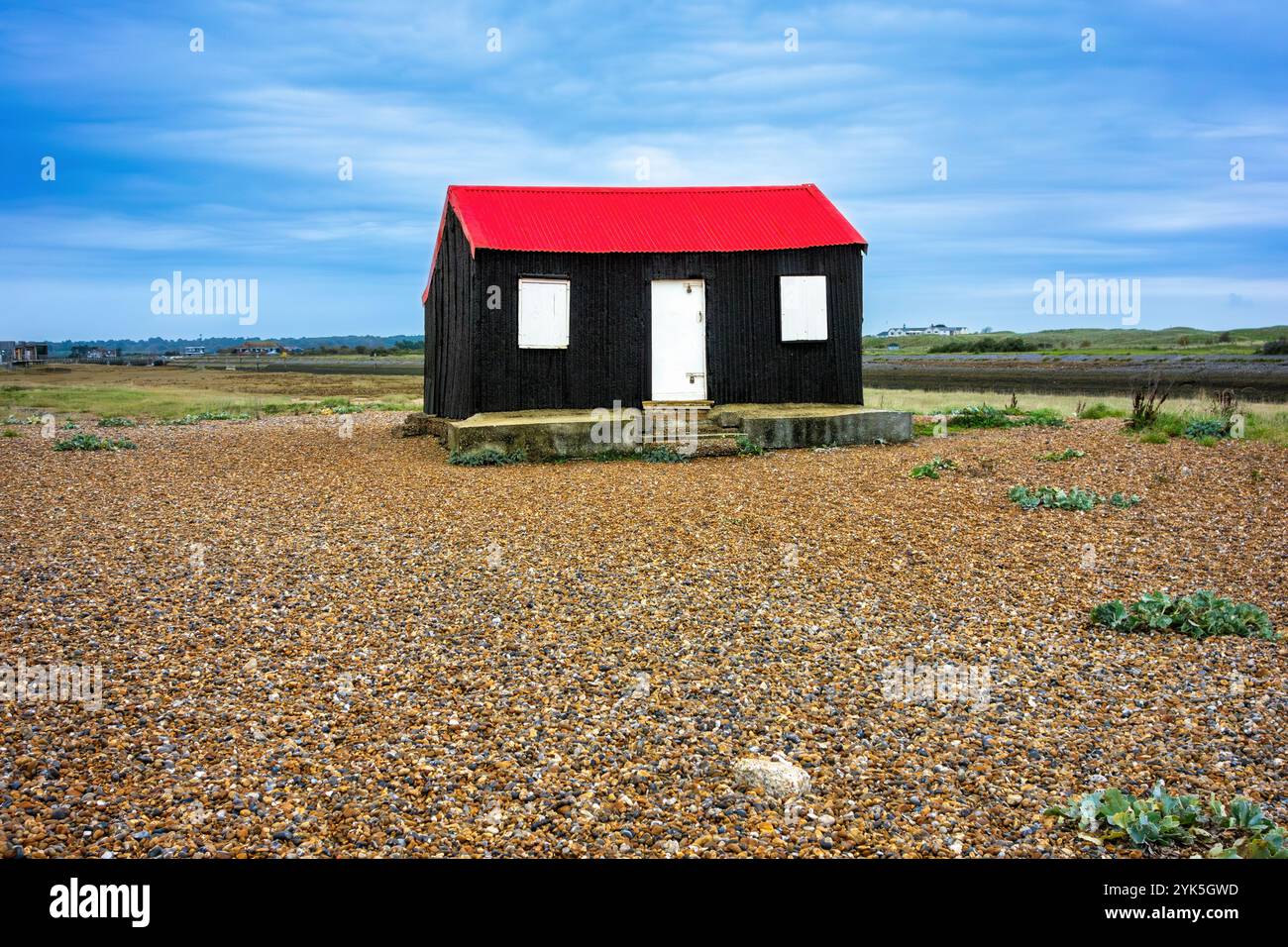 The Fisherman's Hut, a charming black building with a red roof, is ...
