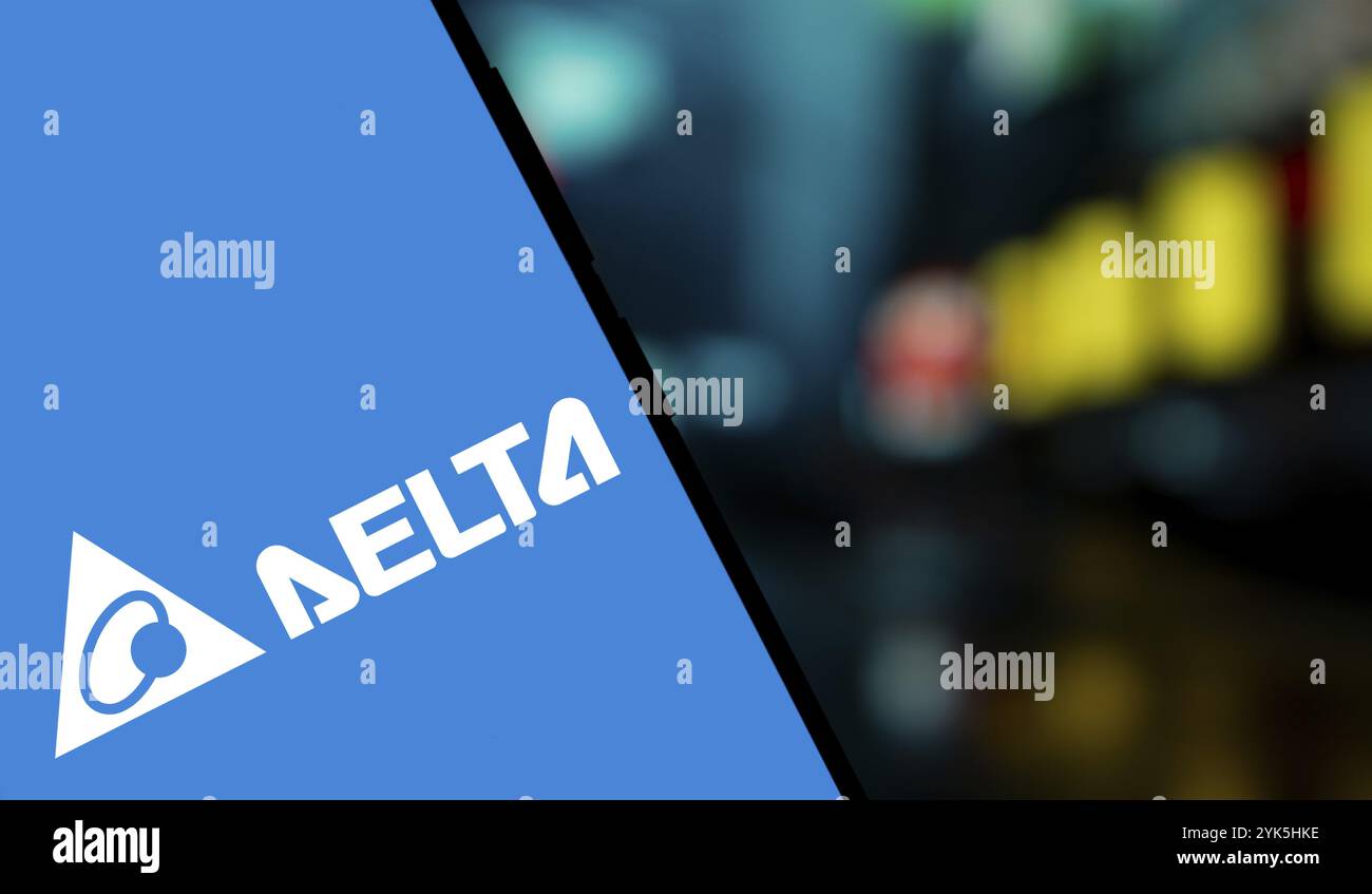 Delta Electronics logo is displayed on smartphone. Delta Electronics is ...
