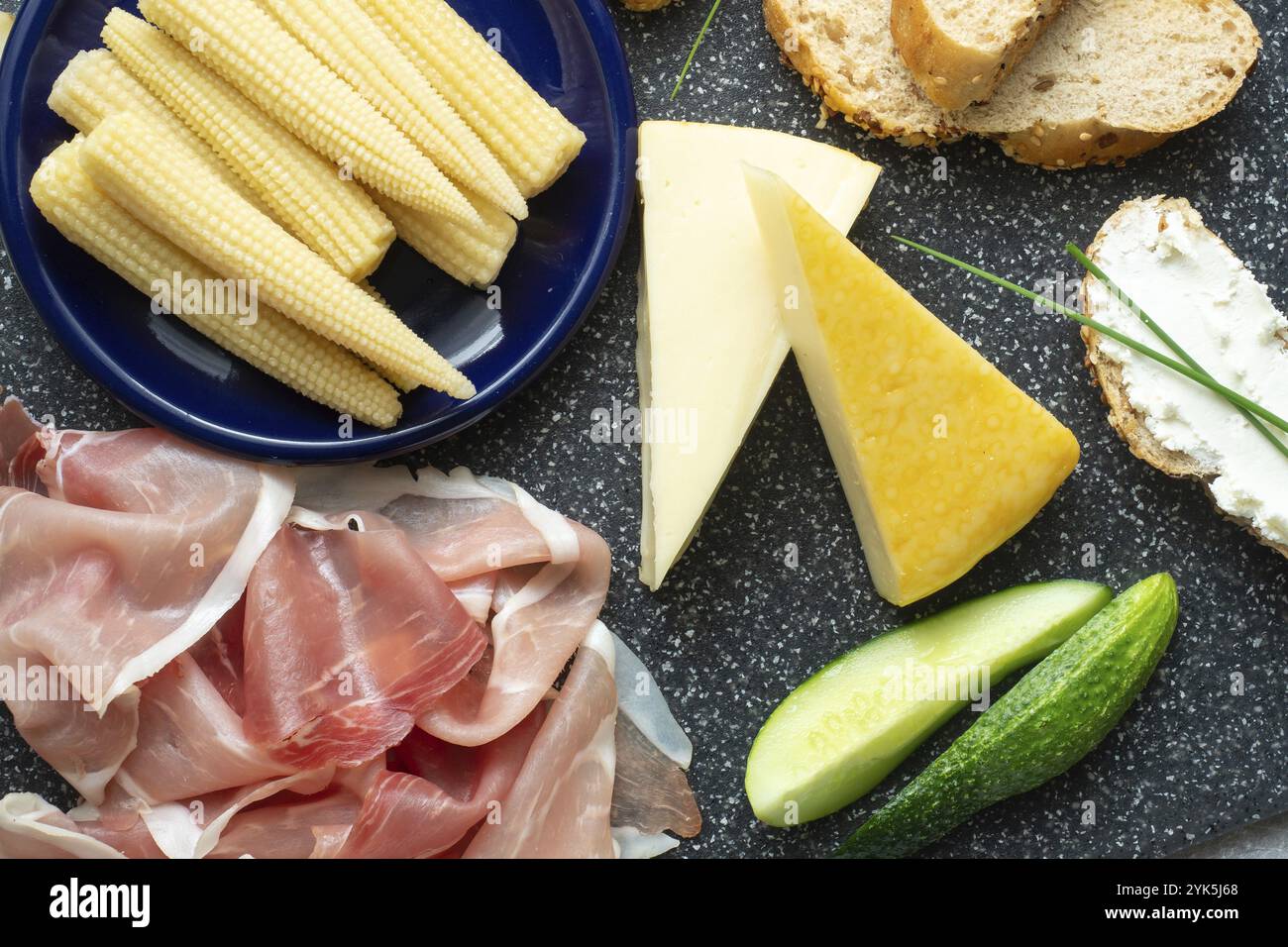 Cold appetizer. Cold cuts. Spicy food on black background, top view ...