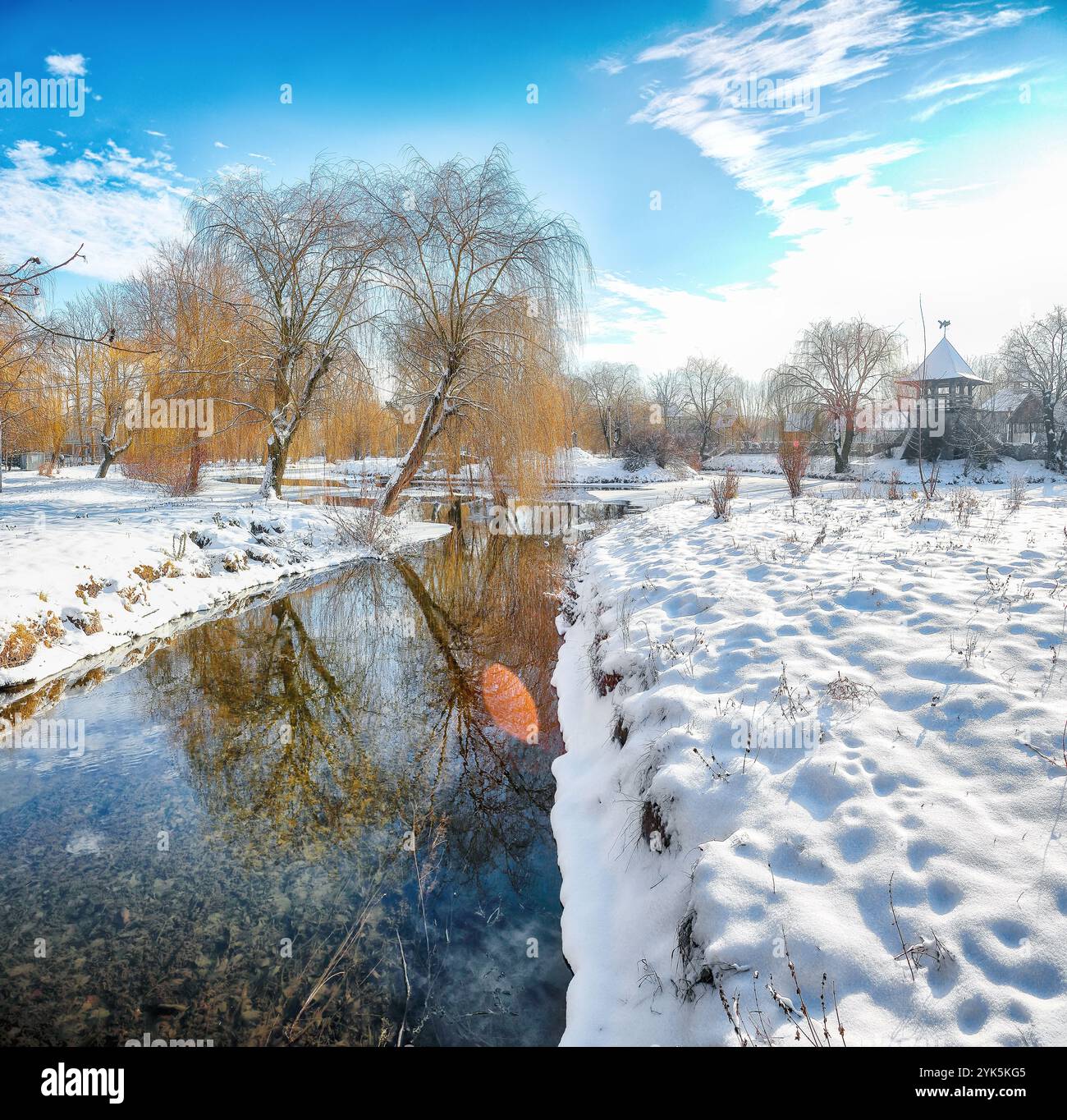 Stunning landscape with snowy trees, beautiful frozen river with ...