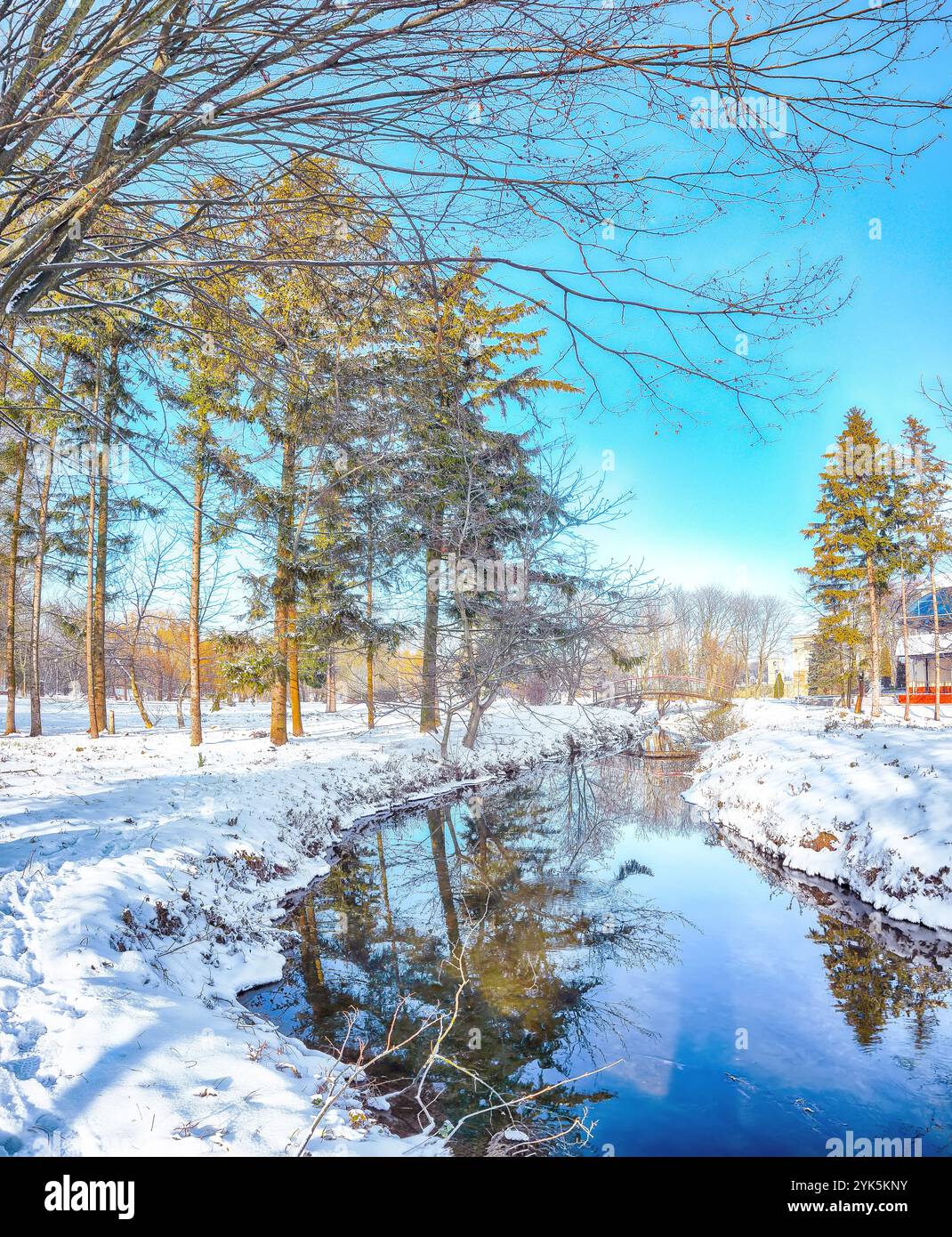 Colorful landscape with snowy trees, beautiful frozen river with ...