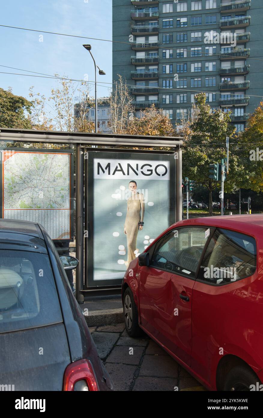 Mango advertsing billboard in a bus stop in urban area Milano, Italy ...