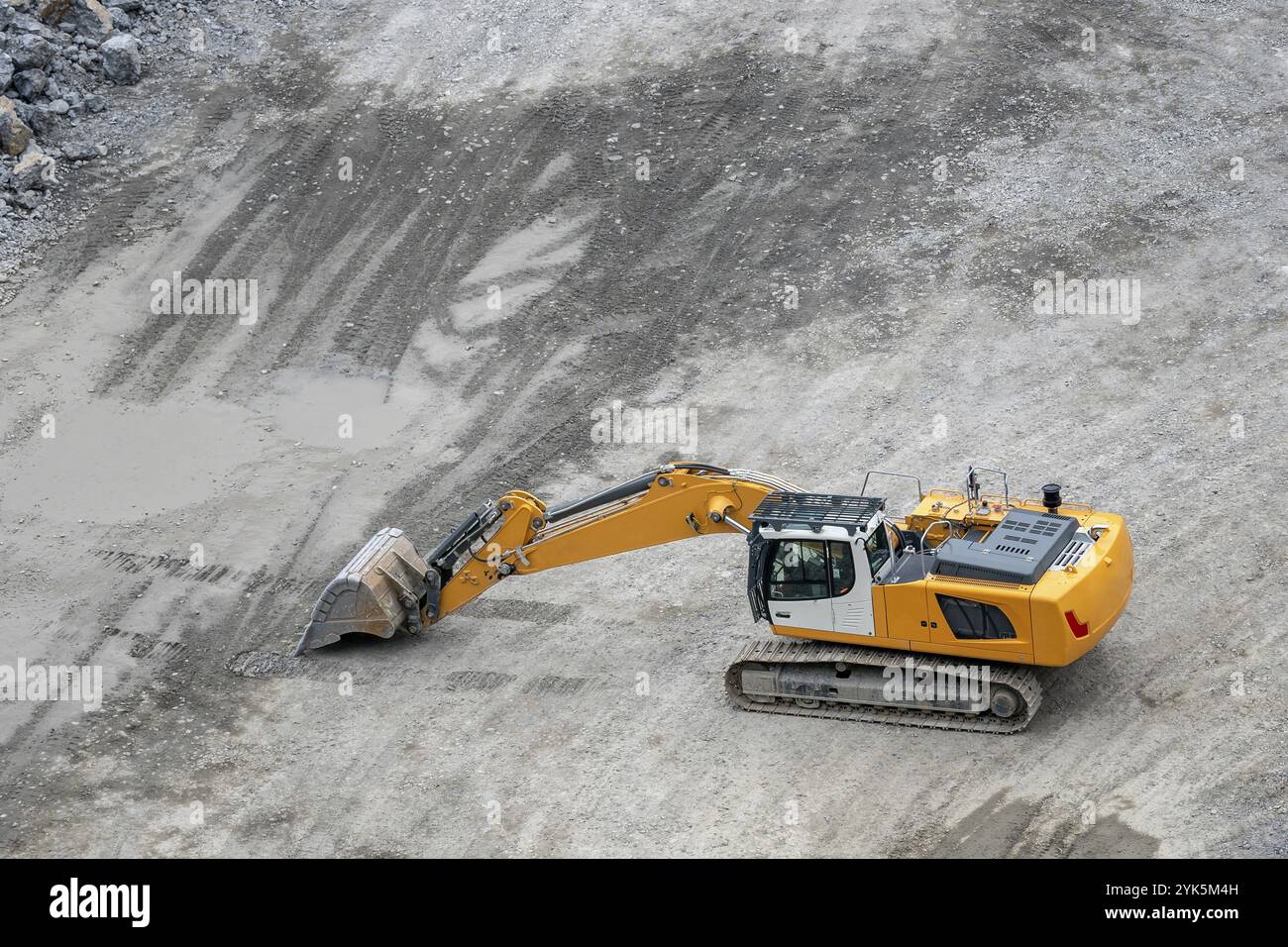 Mining in the granite quarry. Working mining machine, digger. Mining ...