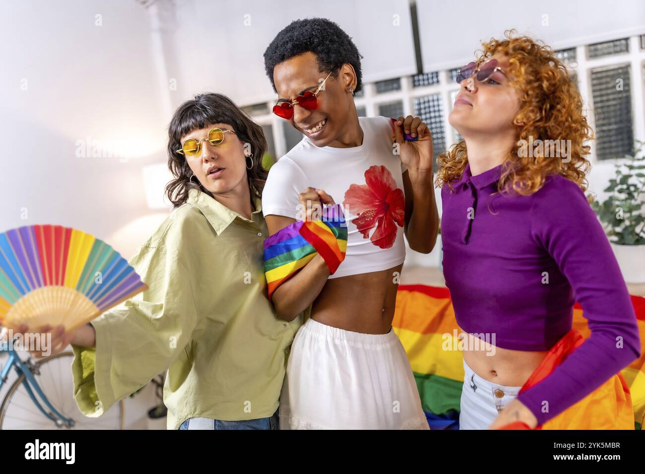 Lgbt multi-ethnic and gender students partying at home celebrating ...