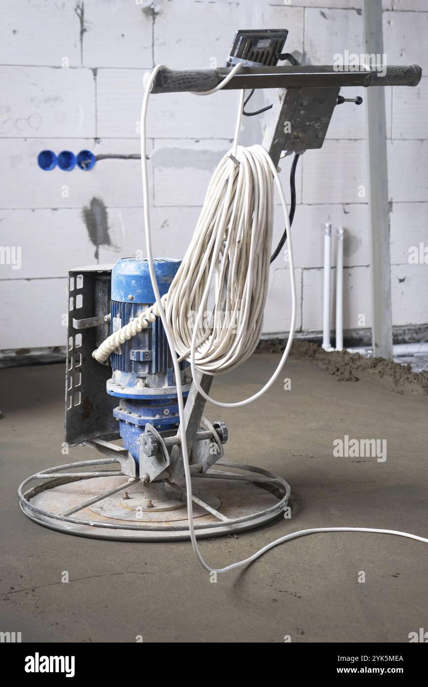 Ramming and grinding of semi-dry floor screed by a machine with a ...