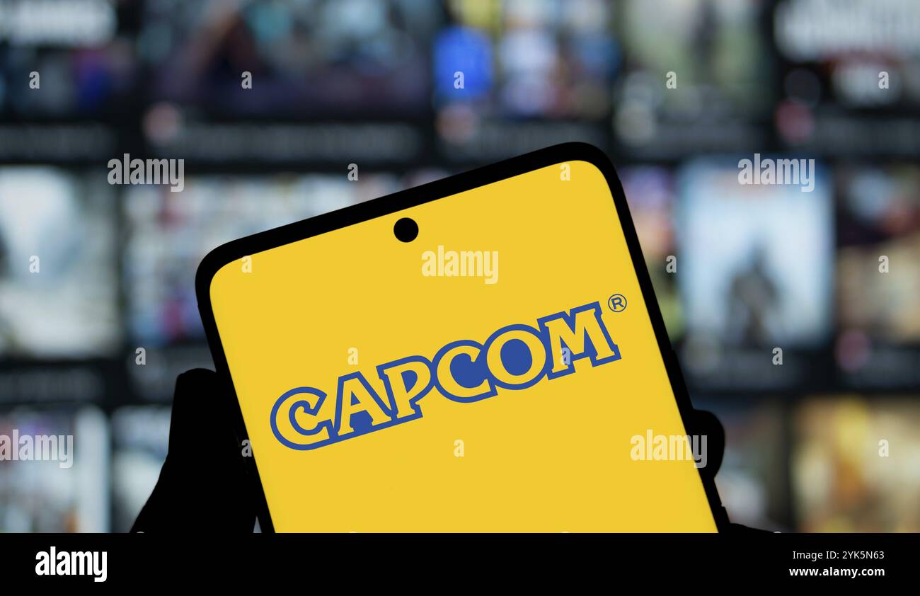 Capcom logo is displayed on smartphone.Capcom is a Japanese video game ...