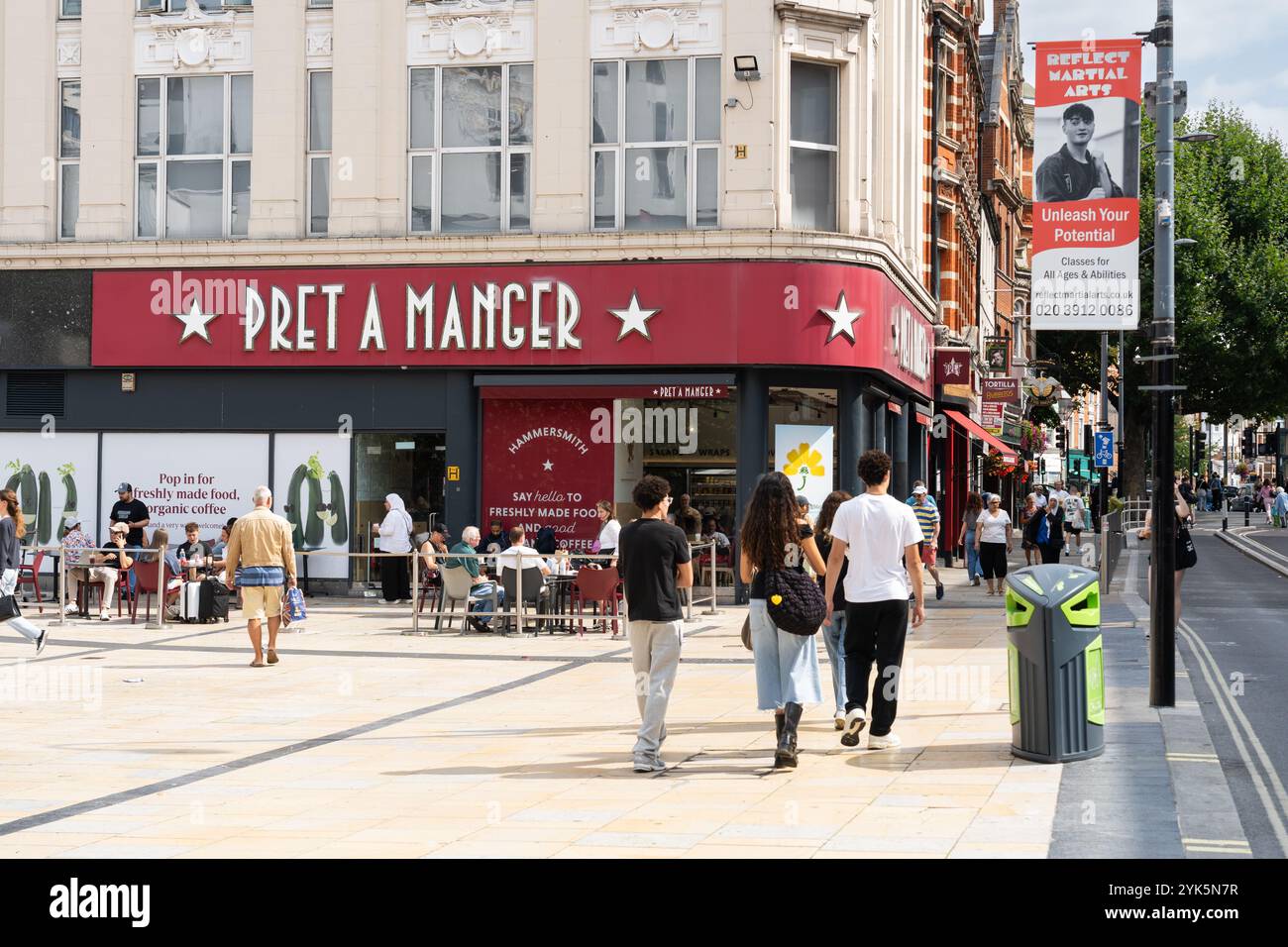 Customers sitting outside a Pret a Manger (commonly known as Pret) - a ...
