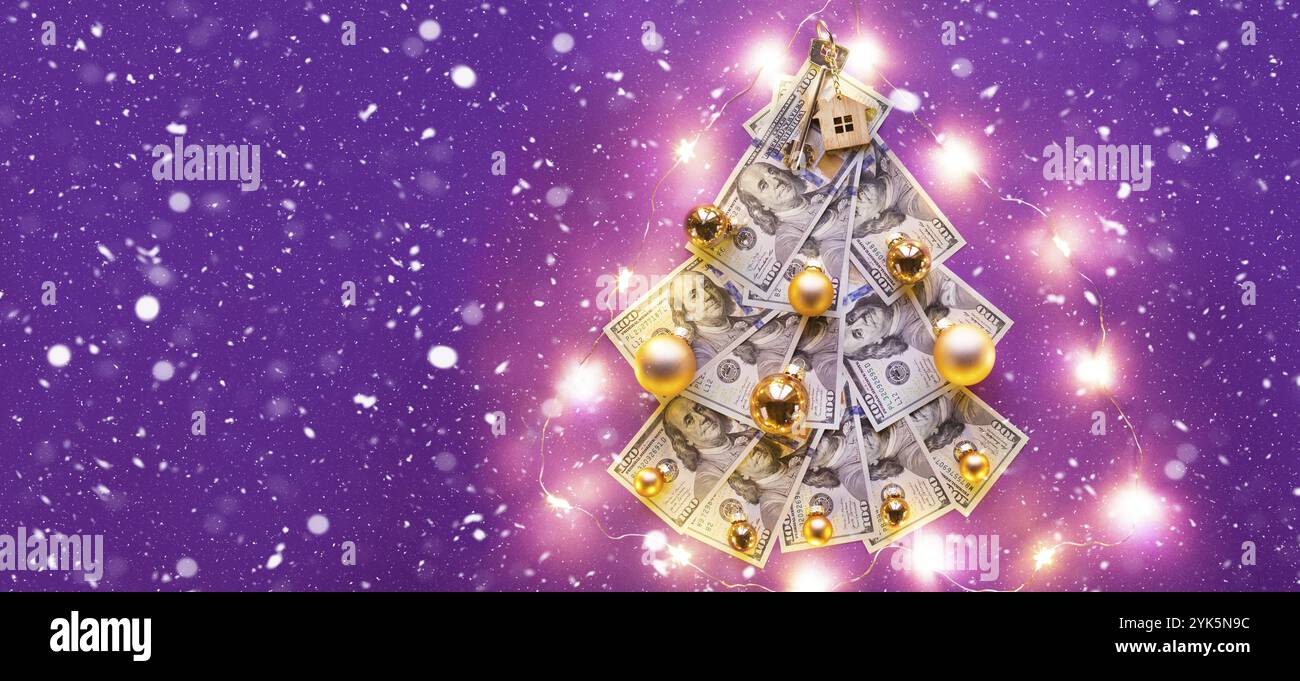 Christmas tree made of 100 dollar bills on purple background with ...