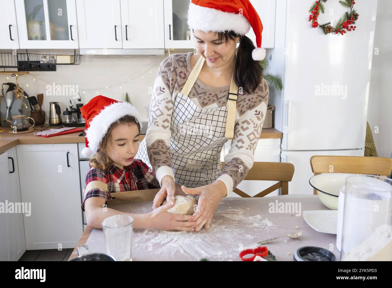 Mom daughter preparing pastries in hi-res stock photography and images ...