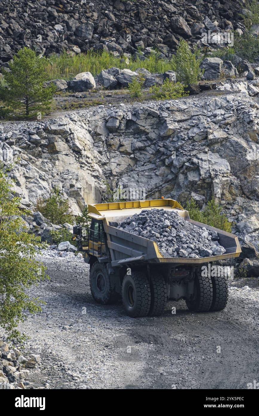 Dump truck in limestone mining, heavy machinery. Mining in the quarry ...
