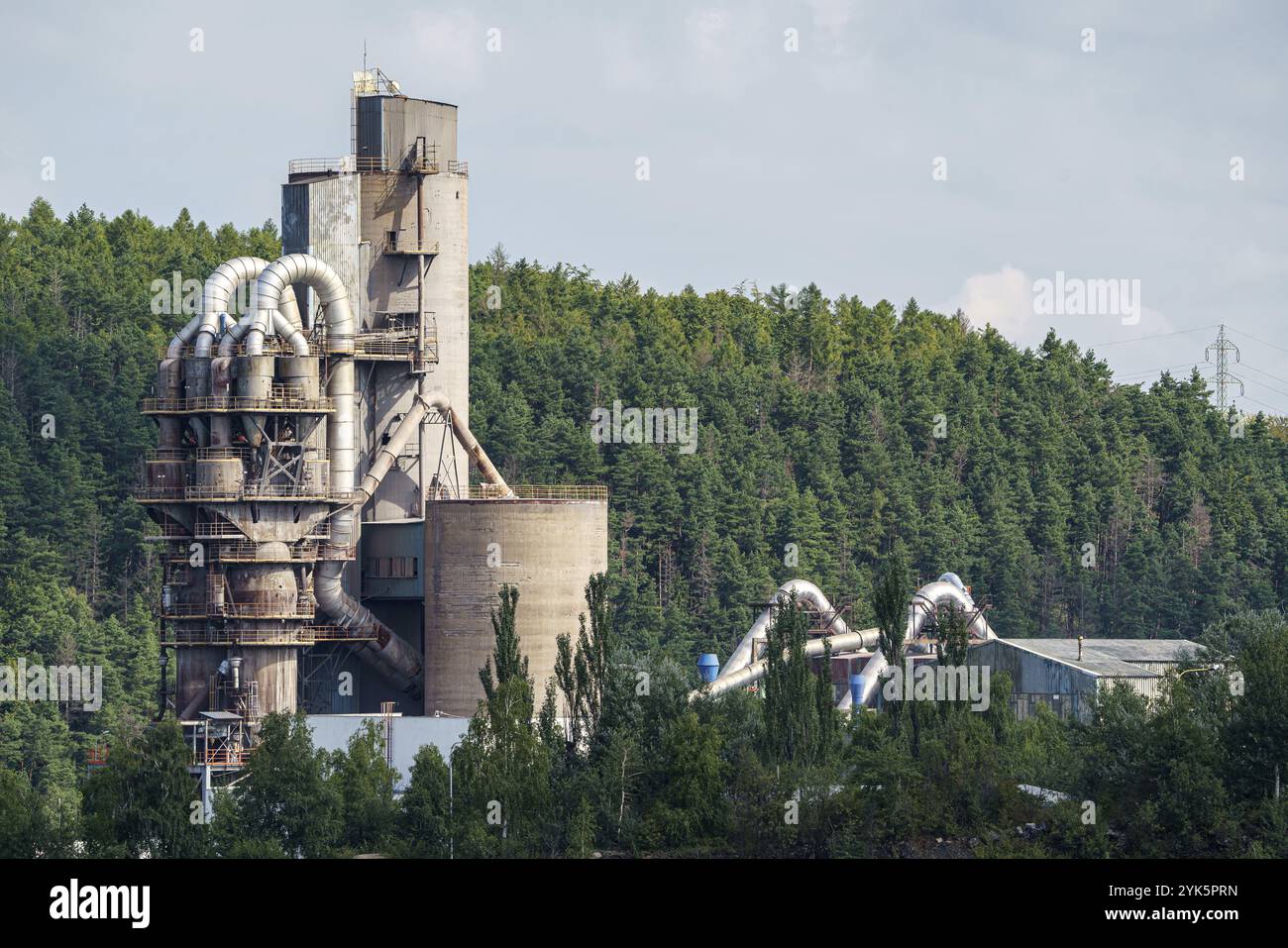 Opencast mining quarry with machinery and mining equipment. Limestone mining for cement ...