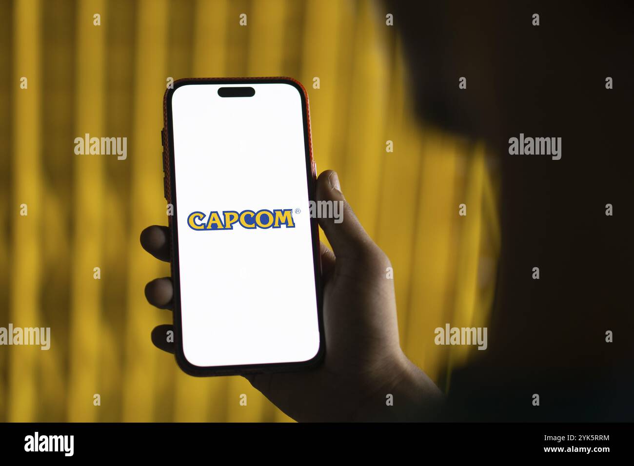 Capcom logo is displayed on smartphone.Capcom is a Japanese video game ...