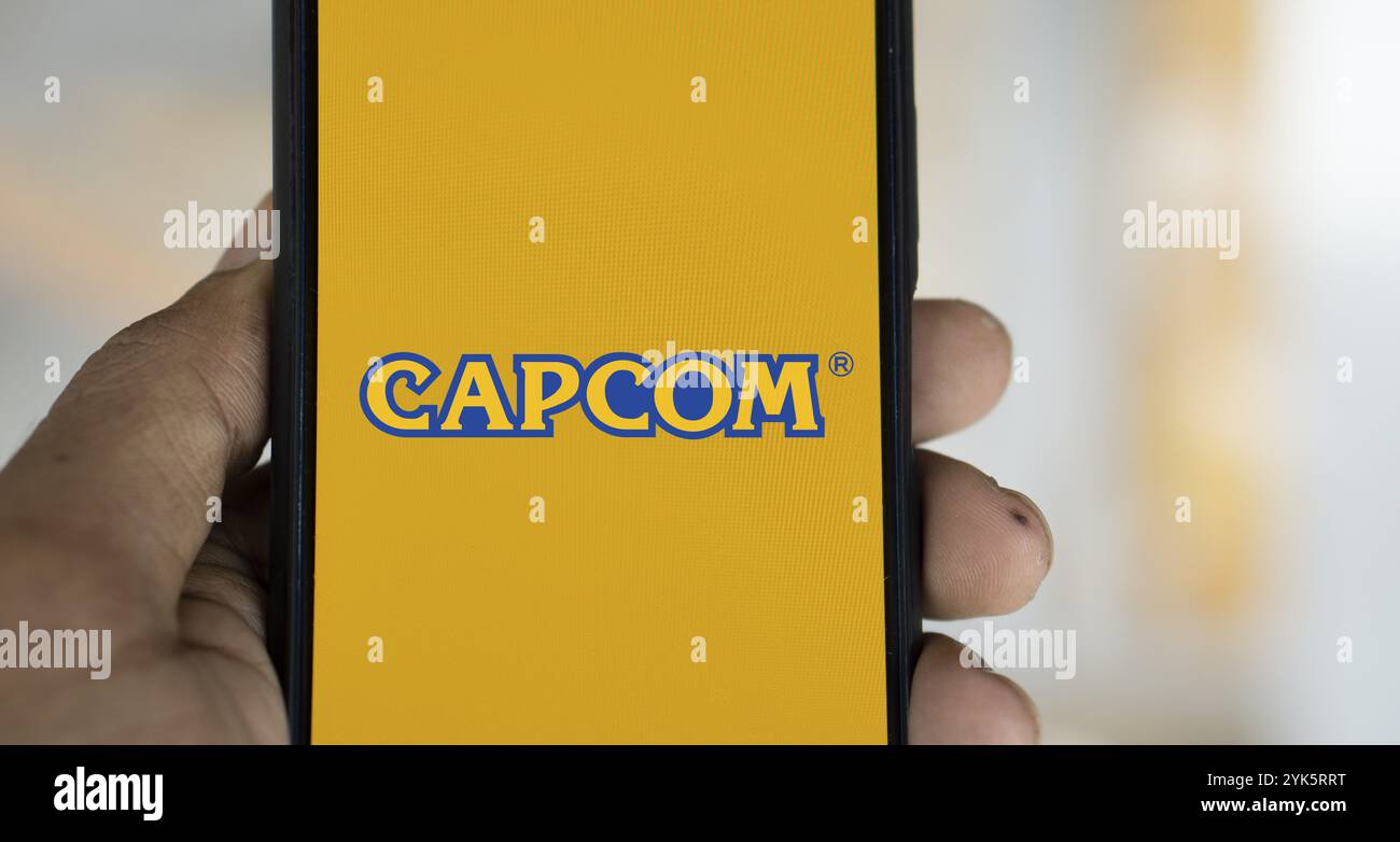 Capcom logo is displayed on smartphone.Capcom is a Japanese video game ...