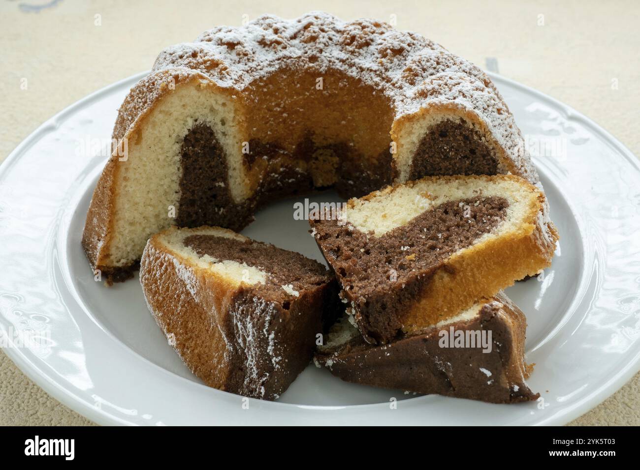 Traditional homemade marble cake. Sliced marble bundt cake on white ...