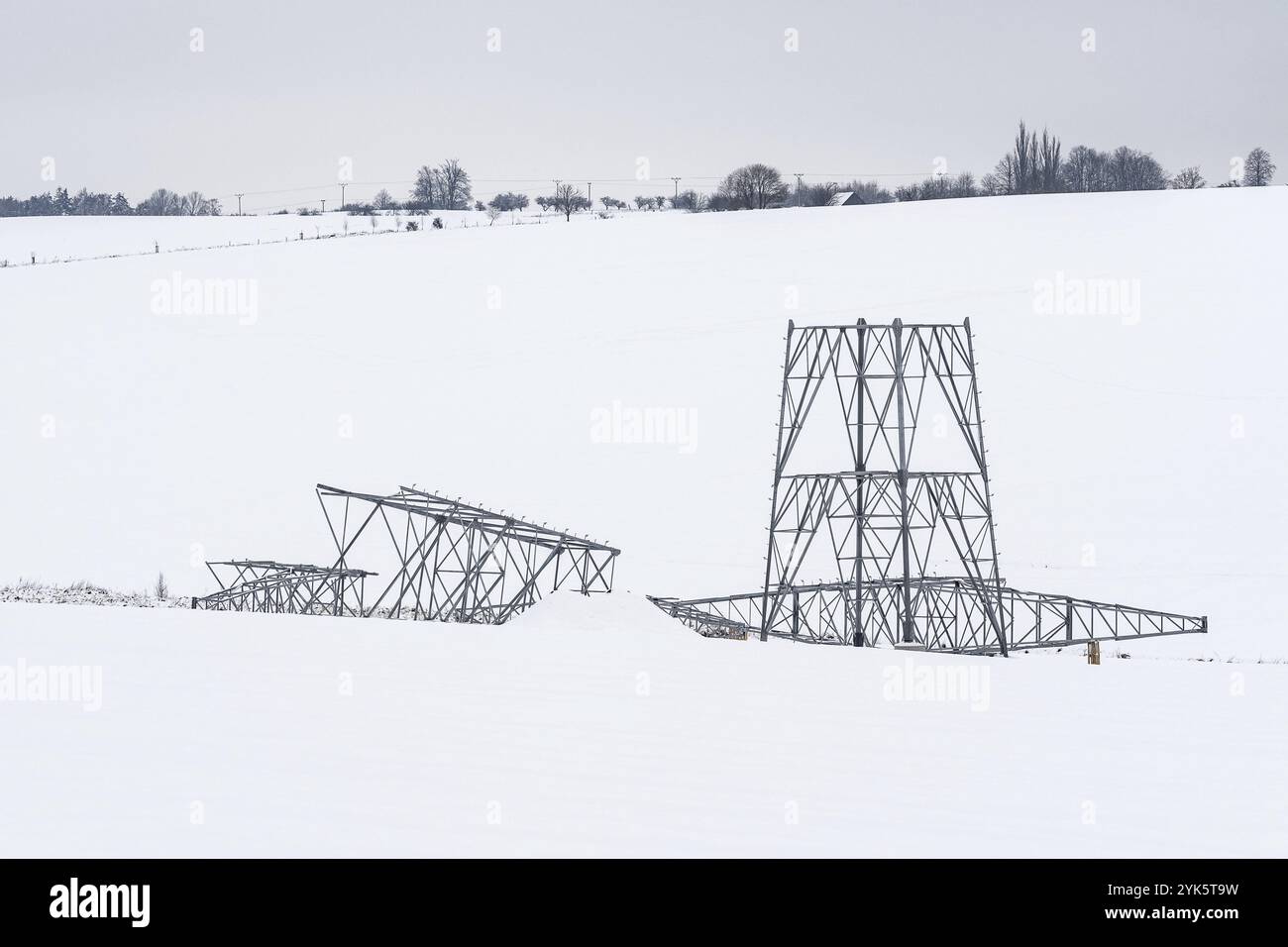 Construction of high voltage pylons in winter. Assembled power ...