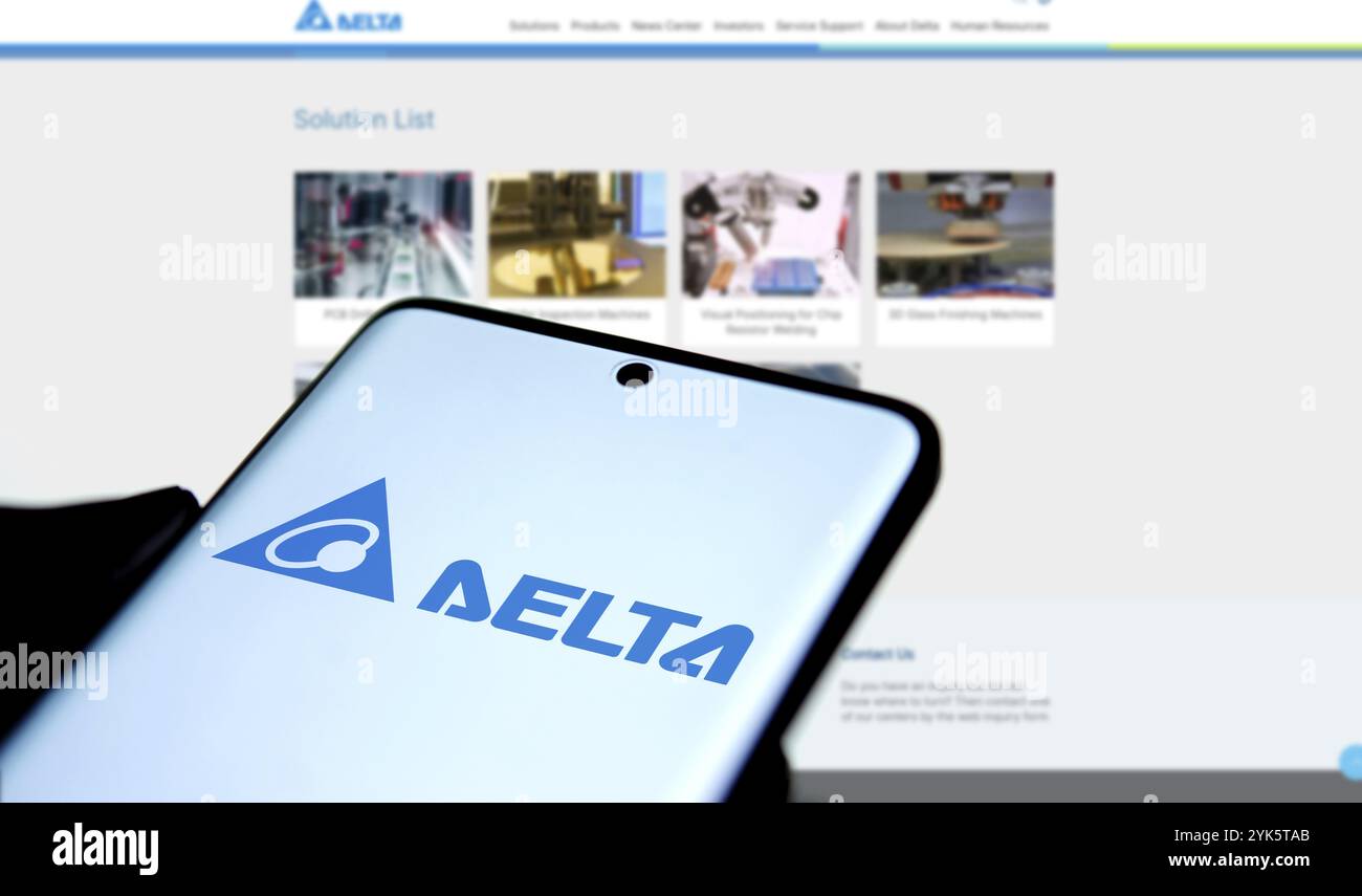 Delta Electronics logo is displayed on smartphone. Delta Electronics is ...