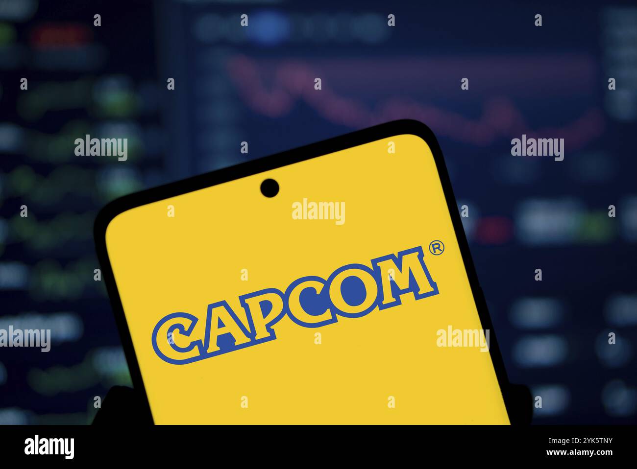 Capcom logo is displayed on smartphone.Capcom is a Japanese video game ...