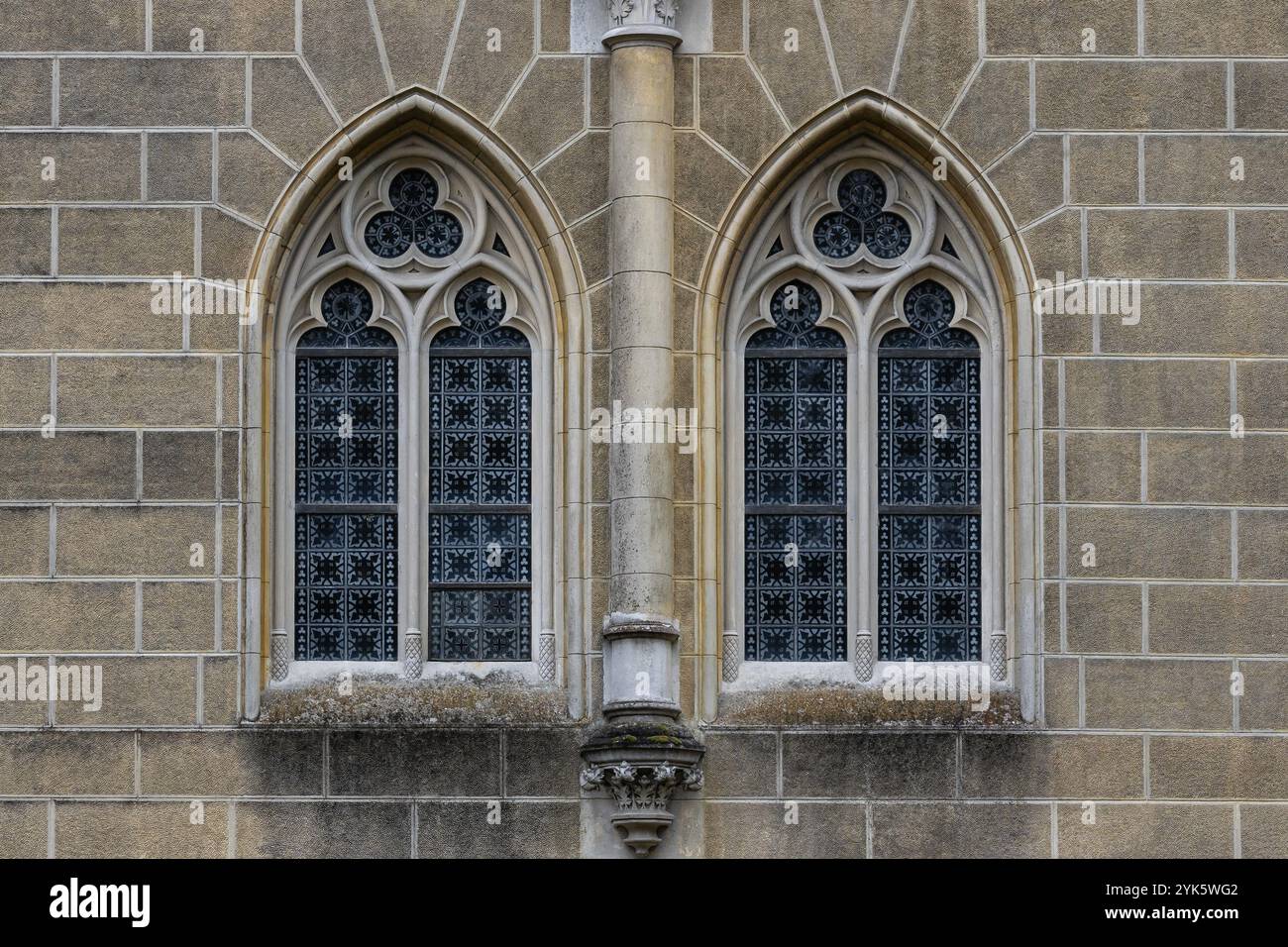 Gothic medieval stained glass window and stone arch. Architectural ...