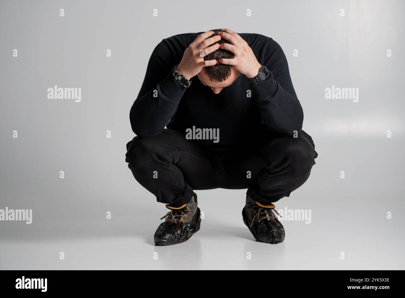 Emotional Struggle: A Young Man in Contemplation Stock Photo - Alamy