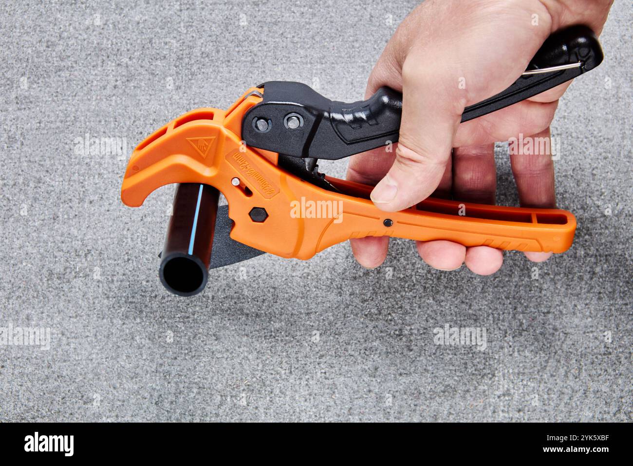 Scissor style cutter for cutting of plastic pipe and tubing Stock Photo ...