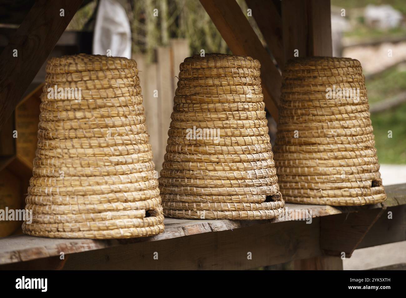 Three old beehives of straw Stock Photo - Alamy