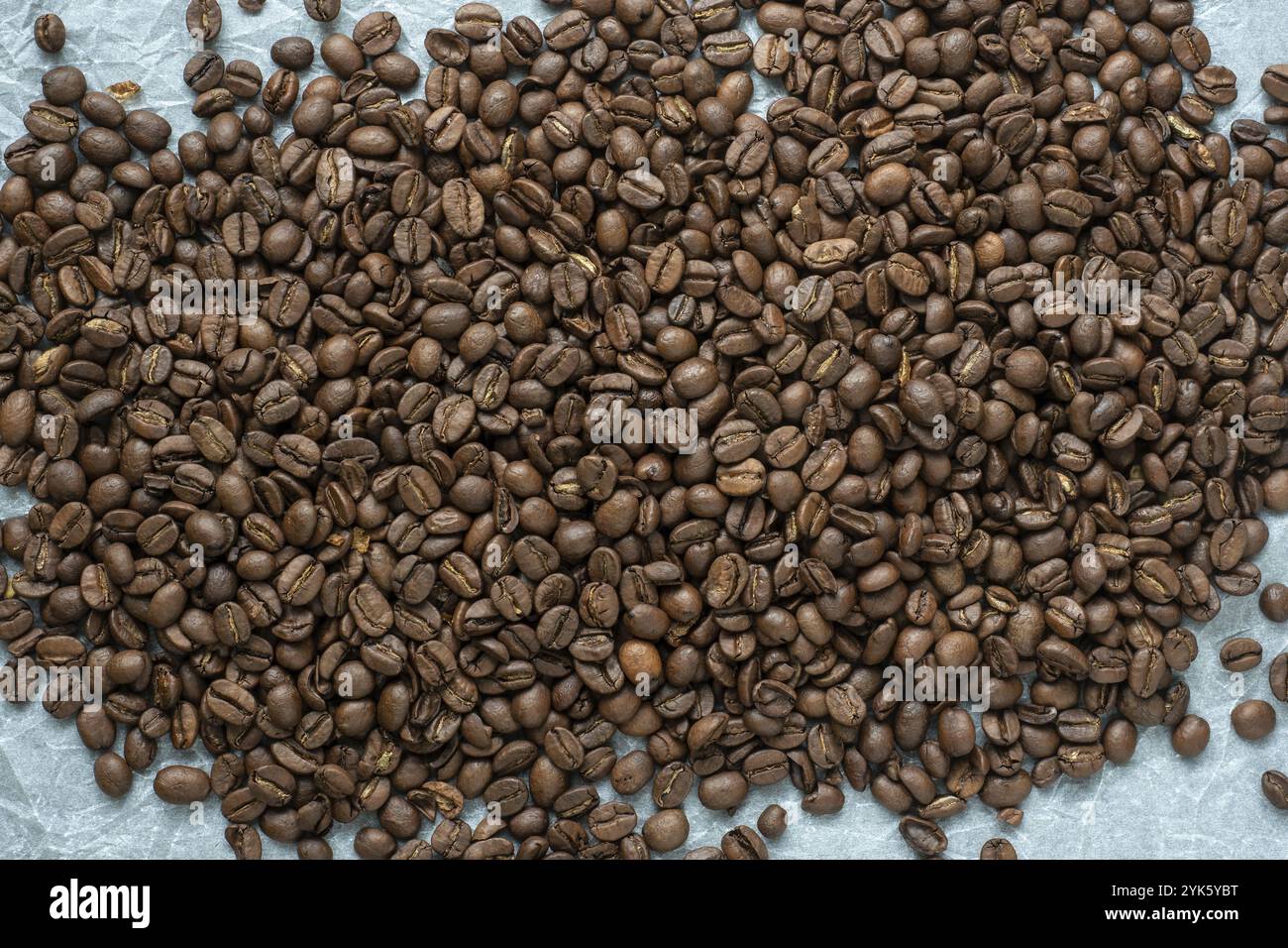 Coffee beans on crumpled paper Stock Photo - Alamy