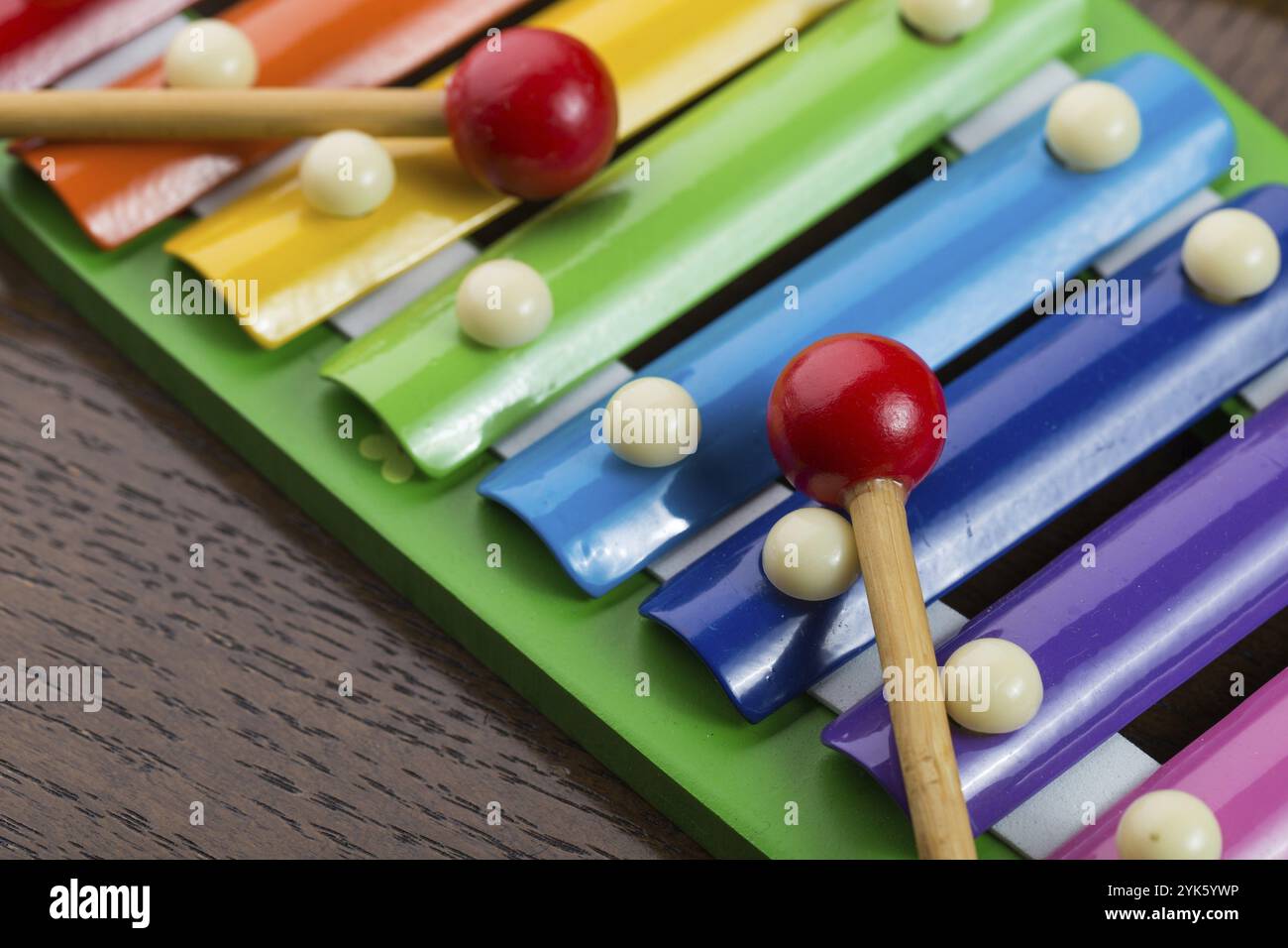 Rainbow colored toy xylophone Stock Photo - Alamy