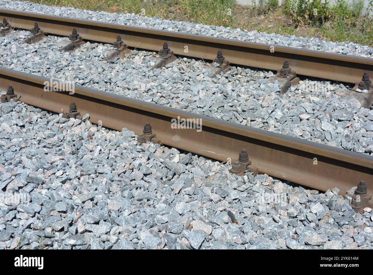 Industry, transport, railway track with wide metal rails and grey ...