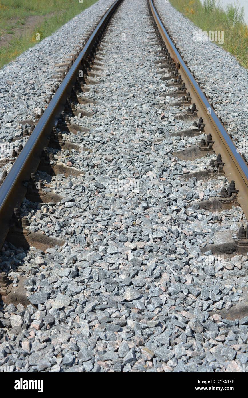 Industry, transport, railway track with wide metal rails and grey ...