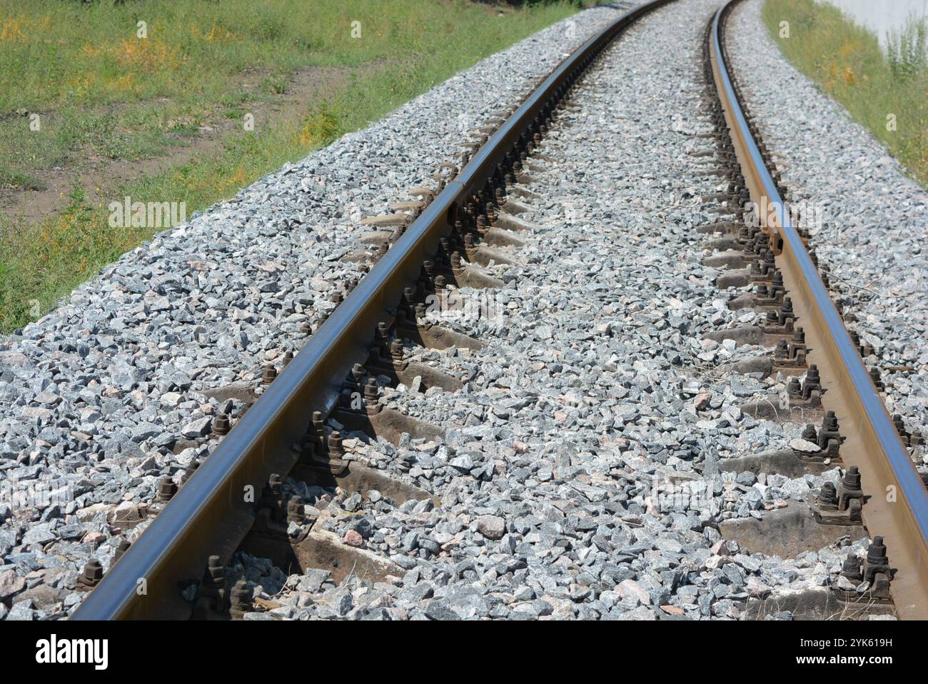 Industry, transport, railway track with wide metal rails and grey ...