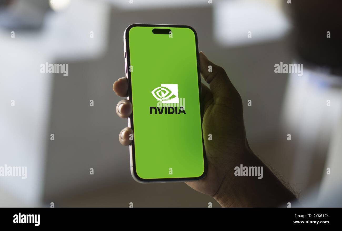 Nvidia logo on smartphone screen with AI in the background. Nvidia ...