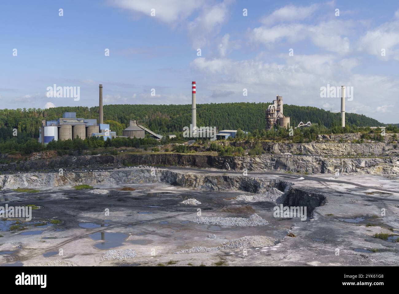 Opencast mining quarry with machinery and mining equipment. Limestone ...