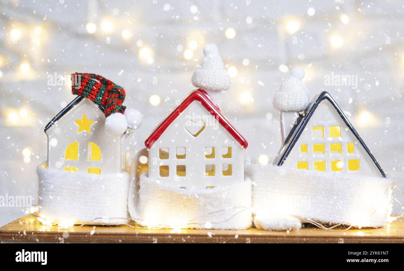 Cozy house is wrapped in a hat and scarf in a snowstorm -window sill ...