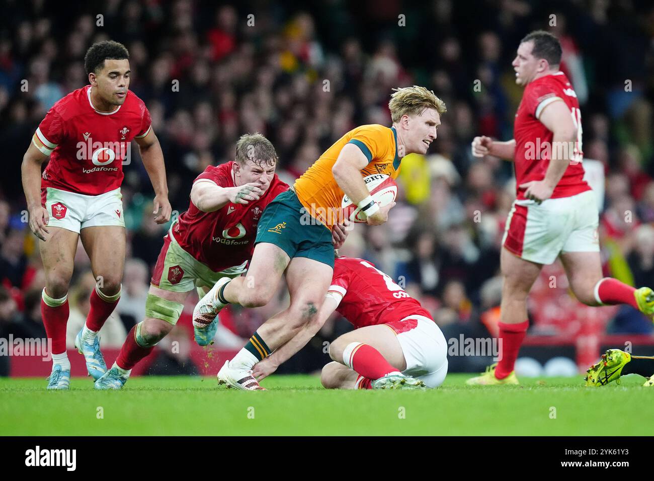 Australia's Tate McDermott (centre right) runs with the ball during the ...