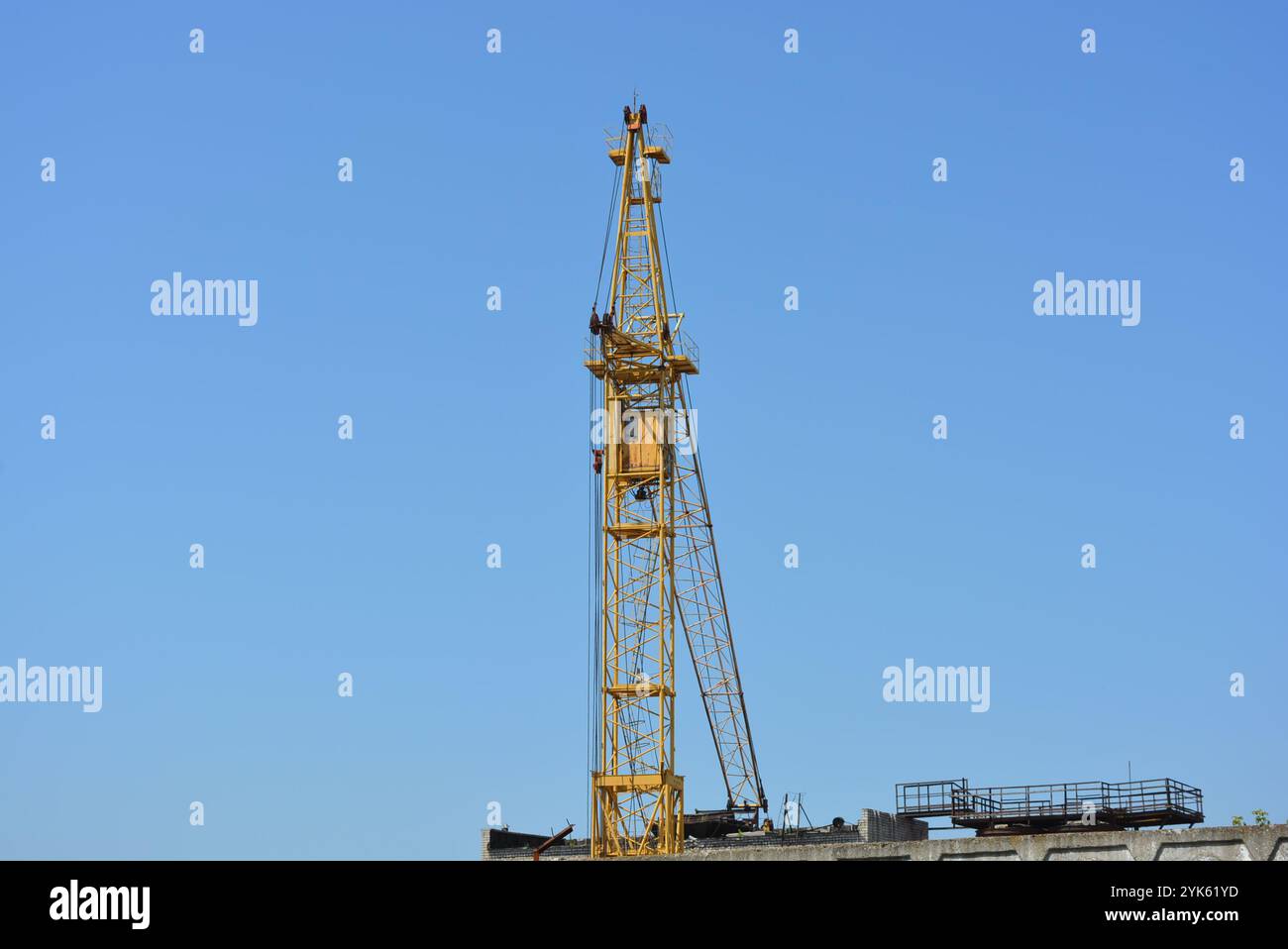 Industry, heavy metal equipment. A tall tower crane for loading large ...